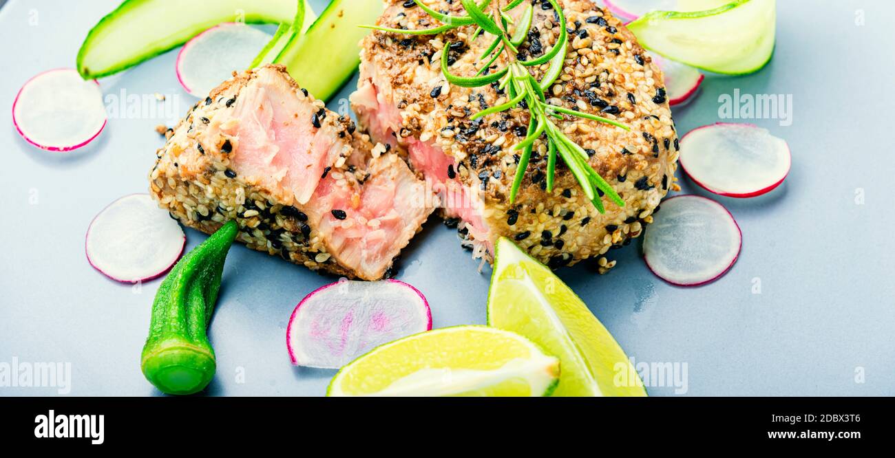 Baked tuna with vegetable garnish.Fish cooked with vegetables.Fried ...
