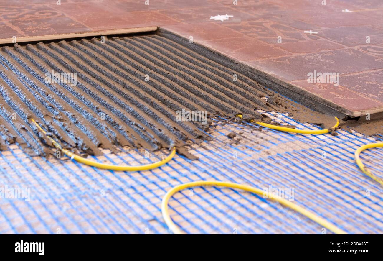 installation of a warm floor from a cable. electric heating system with ...