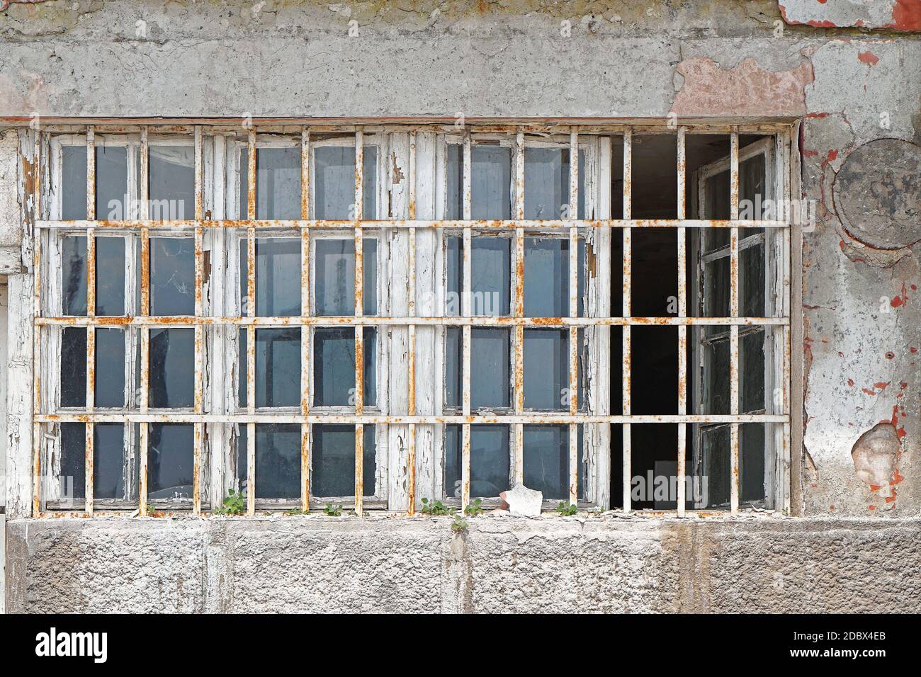 Long window with security bars protection Stock Photo - Alamy