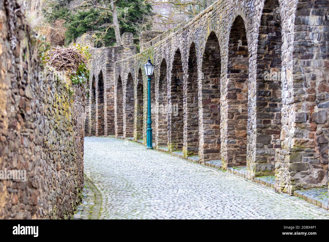 Paved path along the arches in the historic city wall of Bad ...