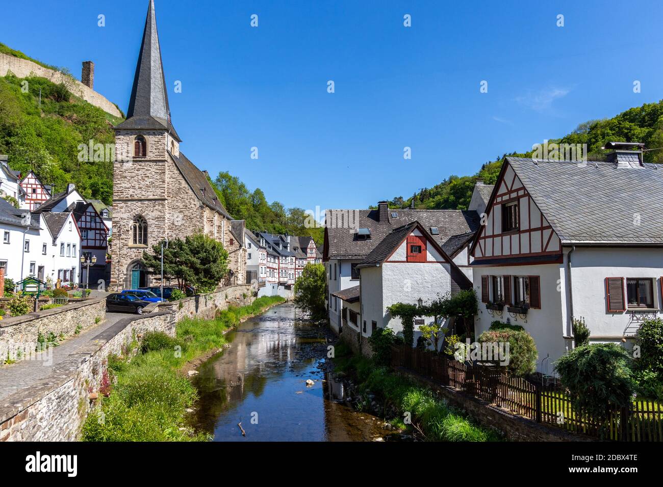 River elz with half-timbered houses and church in Monreal, Germany ...