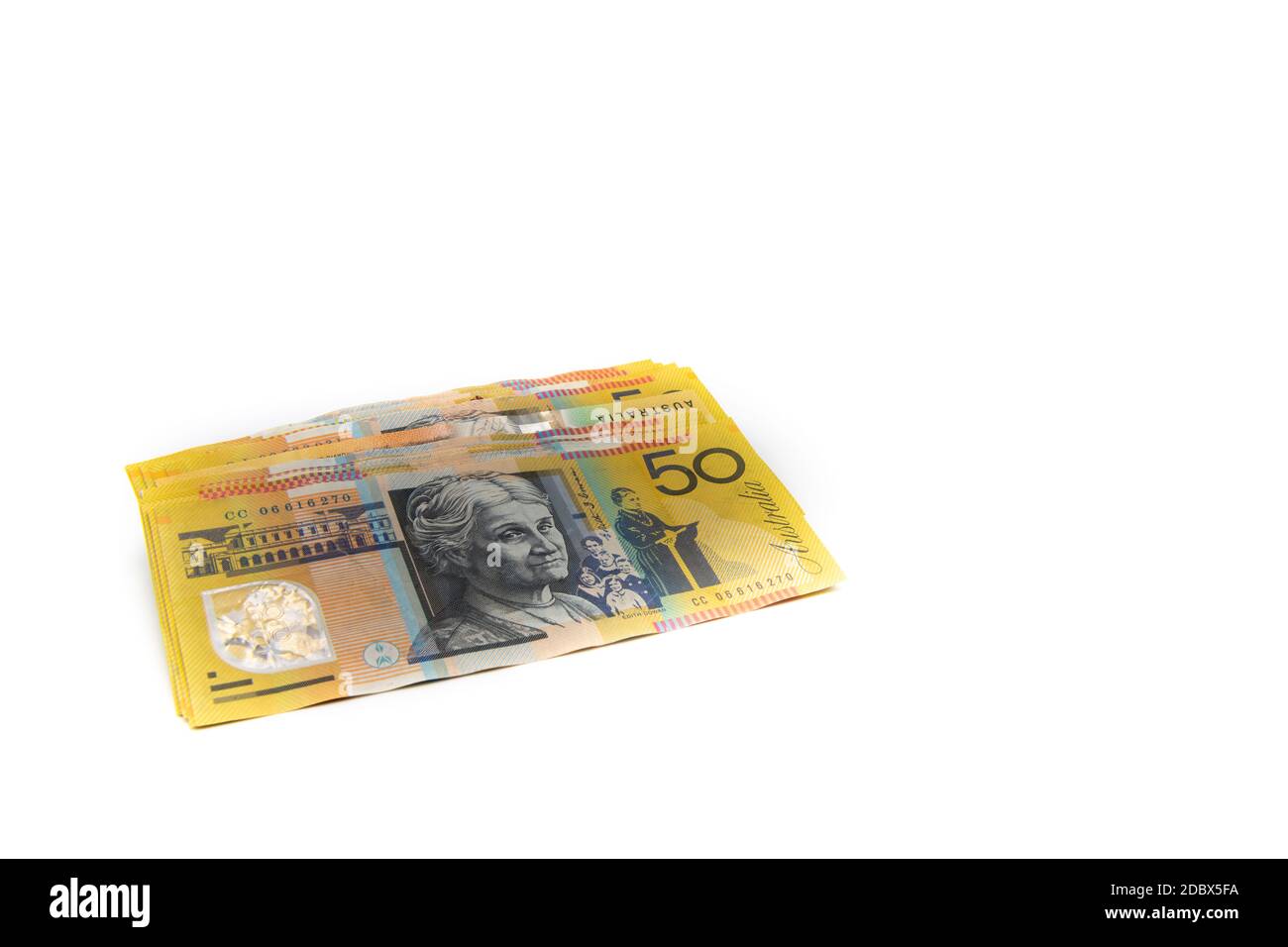 Stack of Australian 50 dollars banknotes isolated over white background ...