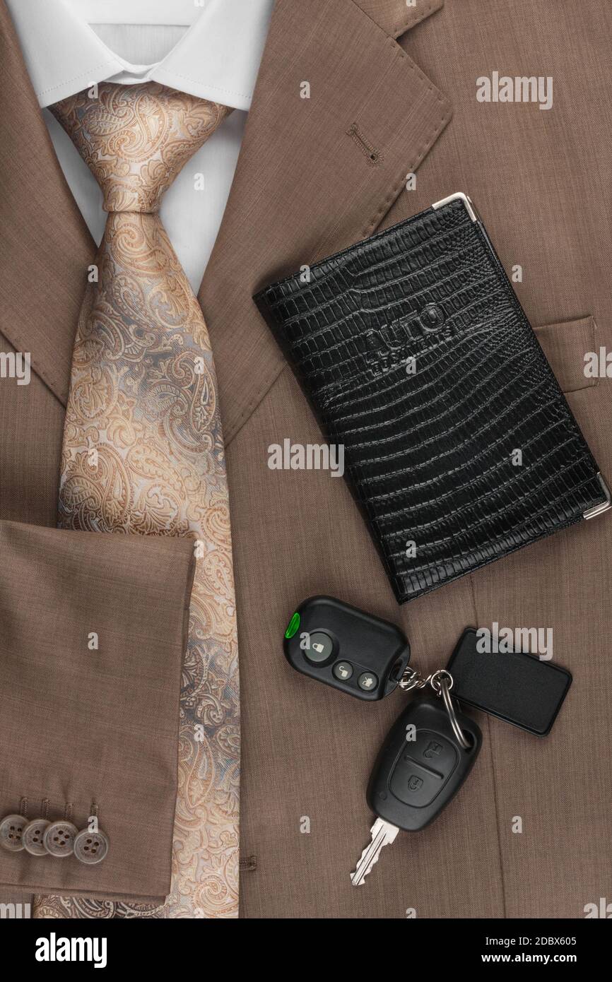 Driver's license and car keys lying on the jacket, can be used as ...