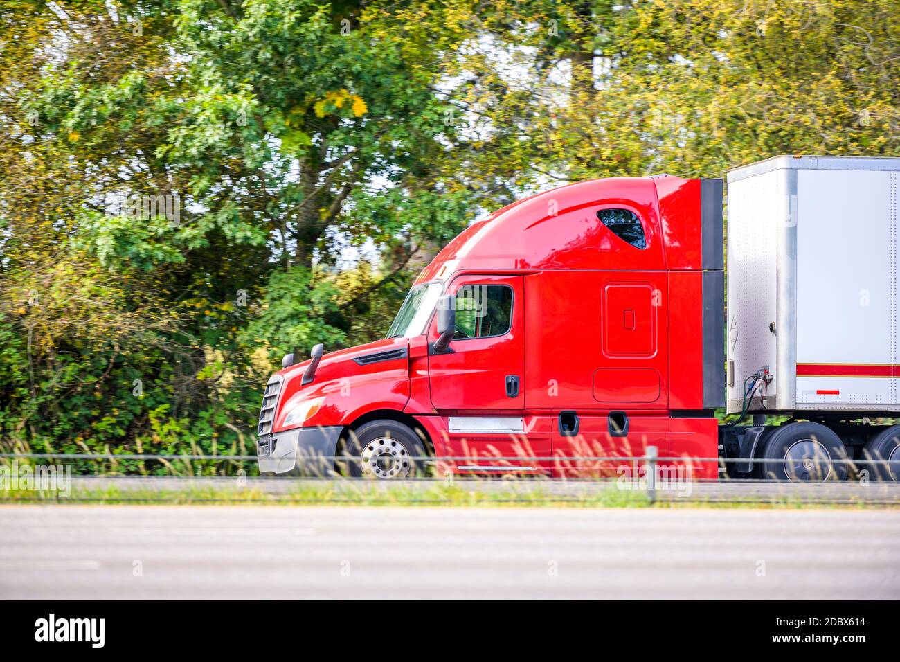 Big rig red long haul industrial semi truck tractor with sleeper cab ...