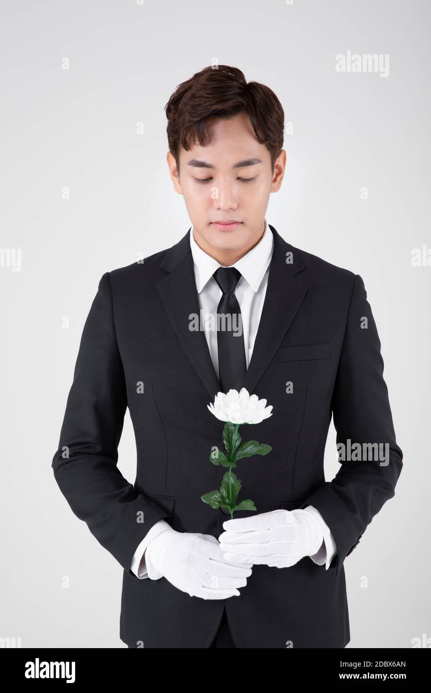 Cremation, people and mourning concept with flowers 021 Stock Photo - Alamy