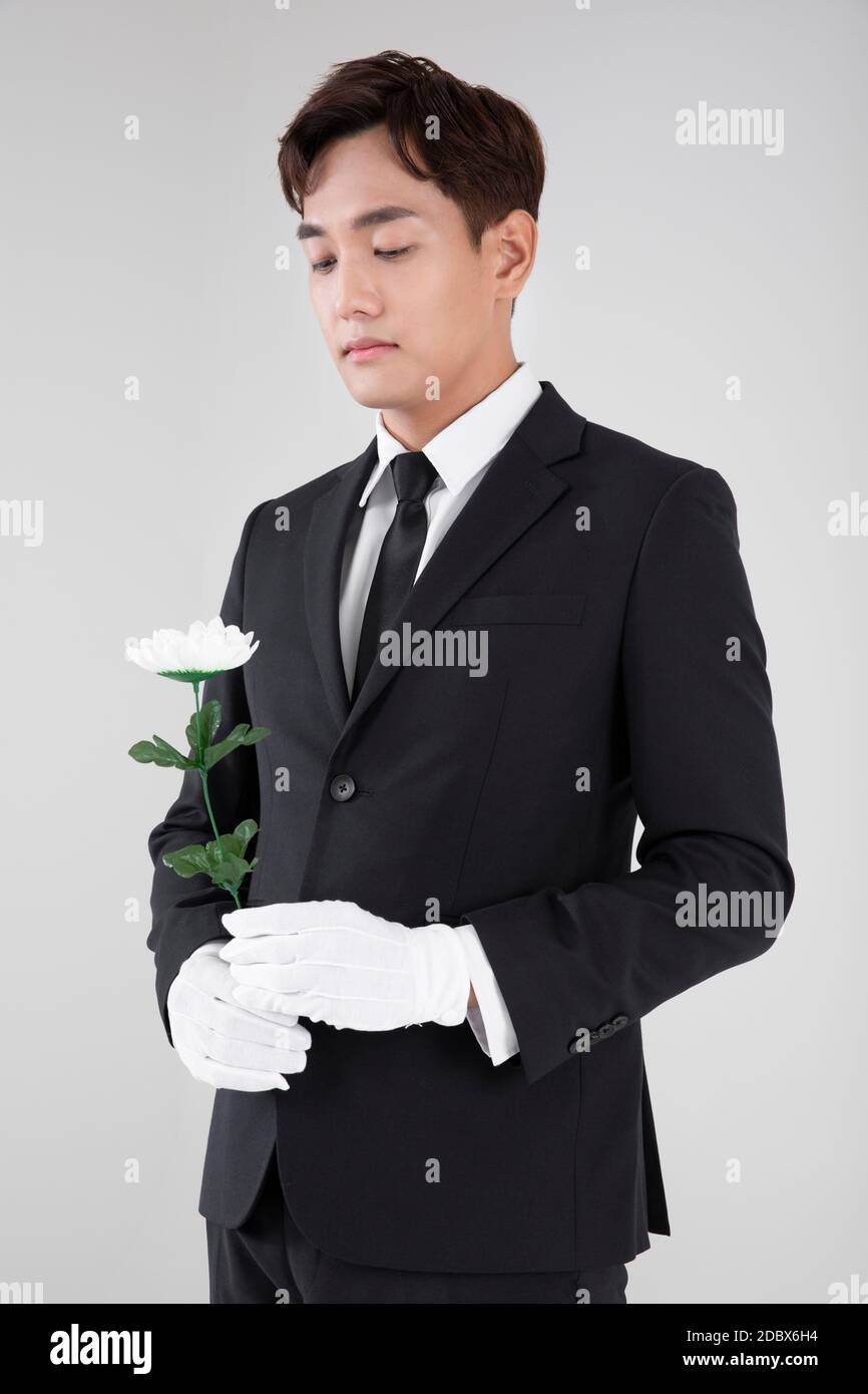 Cremation, people and mourning concept with flowers 022 Stock Photo - Alamy