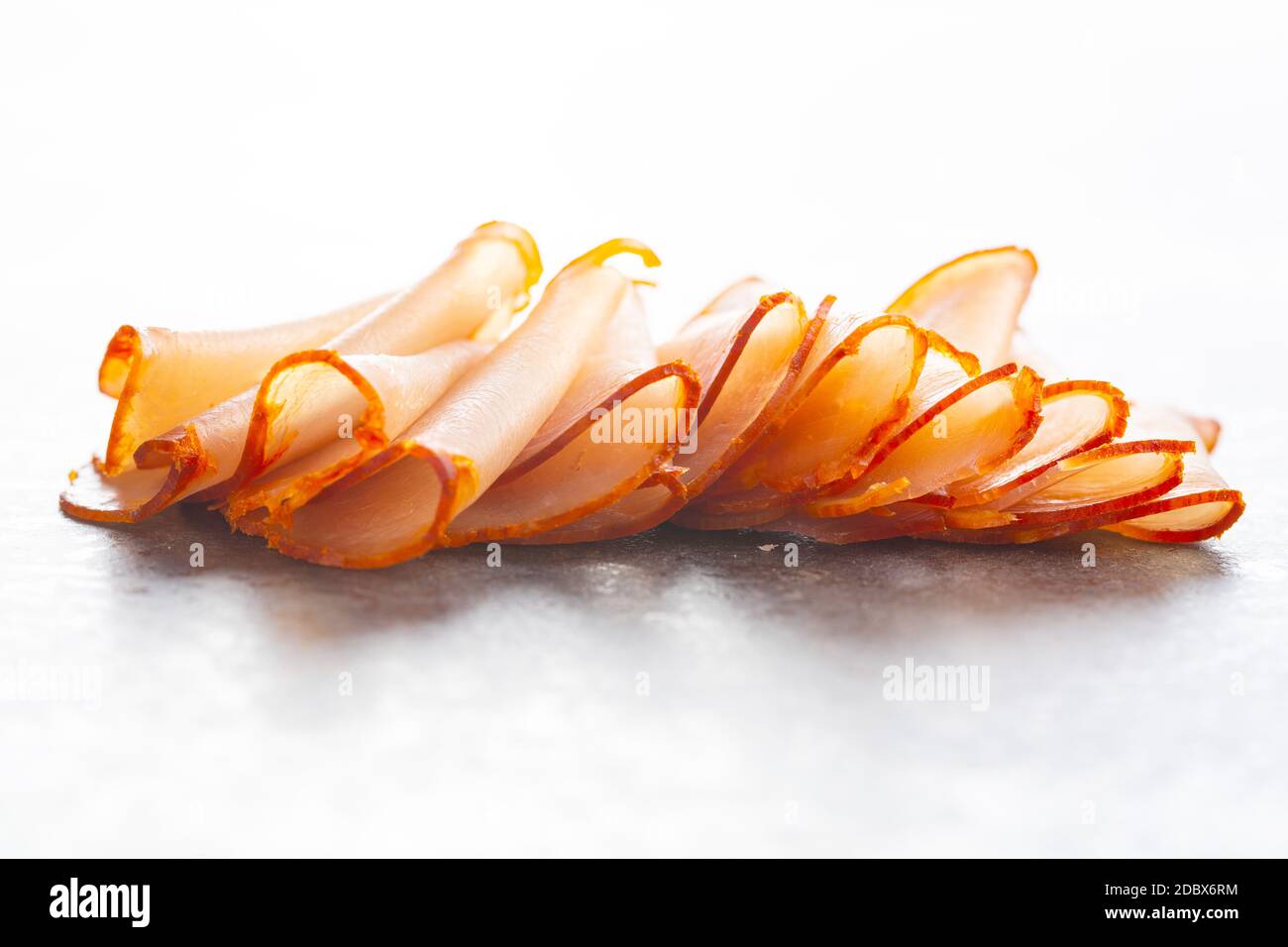 Dried spanish ham. Lomo embuchado on kitchen table Stock Photo - Alamy