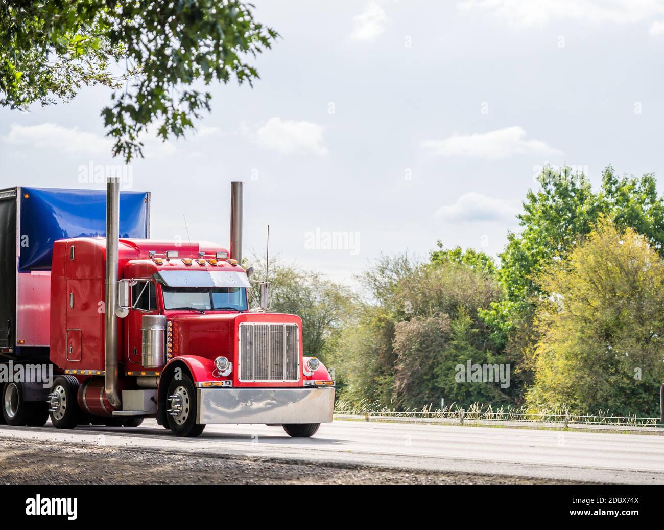 Big rig red classic American industrial semi truck tractor with sleeper ...