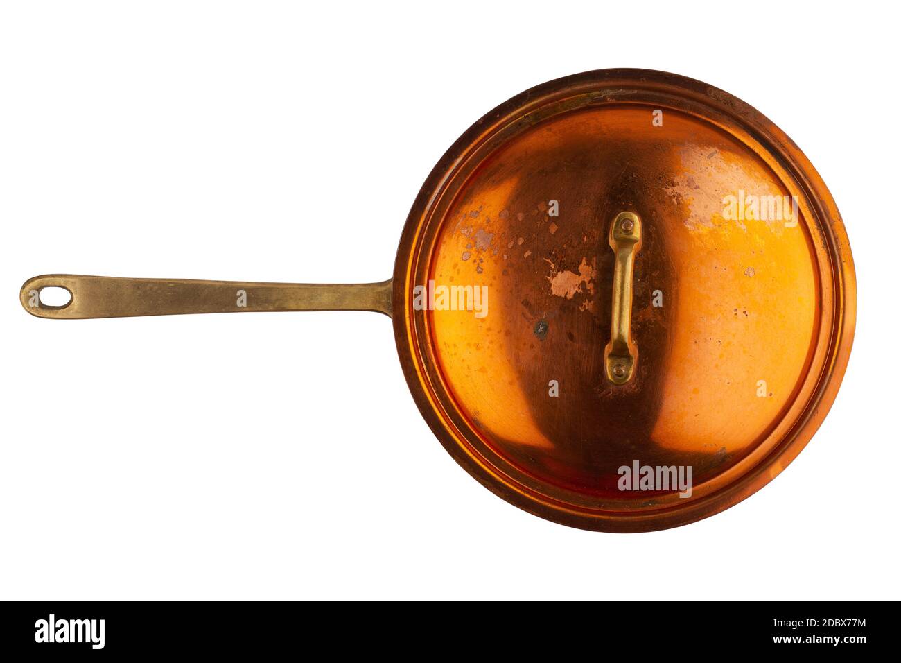 top view closeup of old cooking pan with copper lid and metallic handle ...