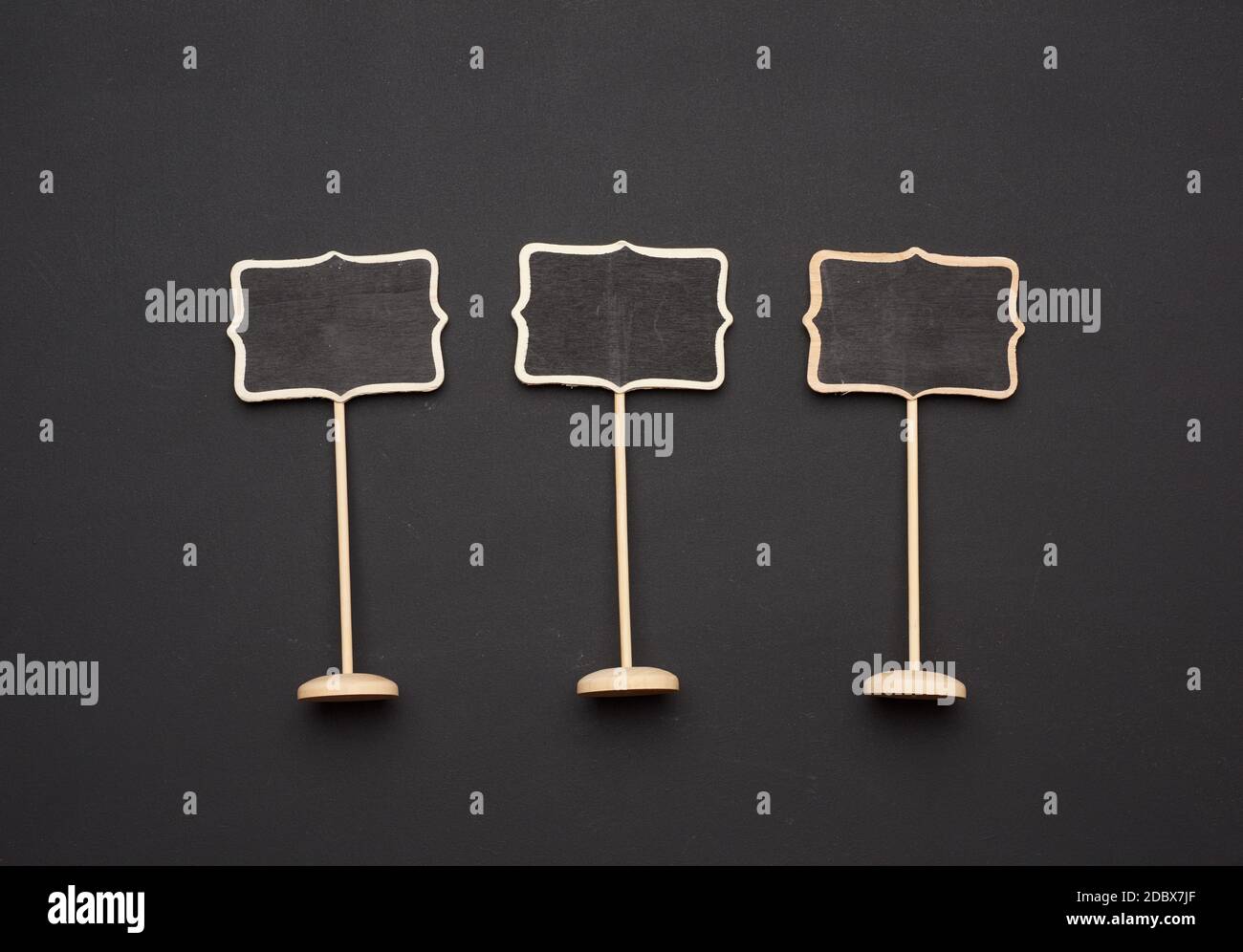 wooden pointer on a stick for writing text, black background, close up ...