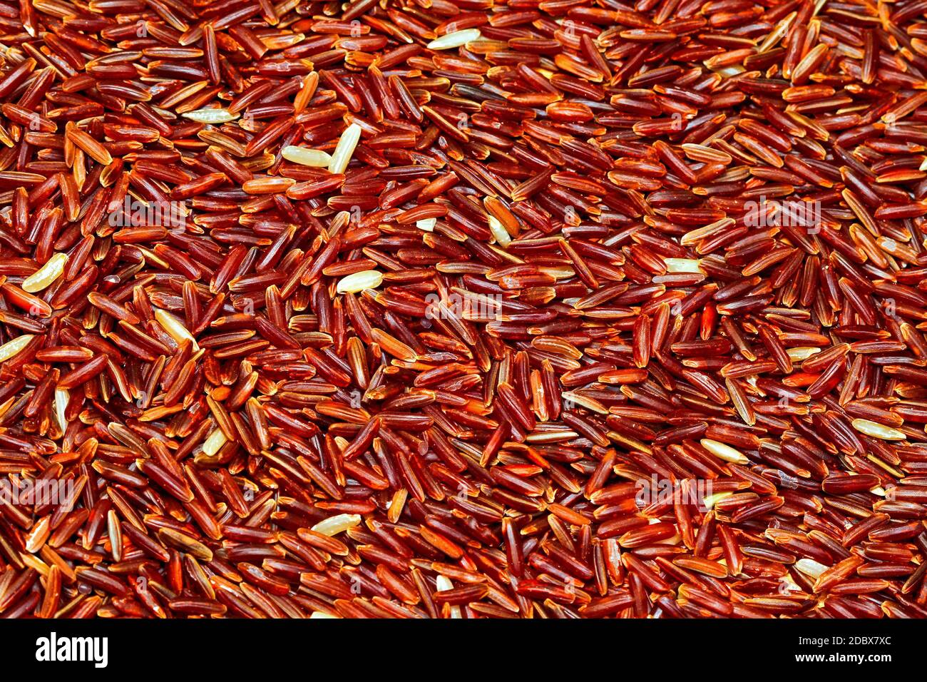 Natural organic whole red rice pattern background Stock Photo - Alamy
