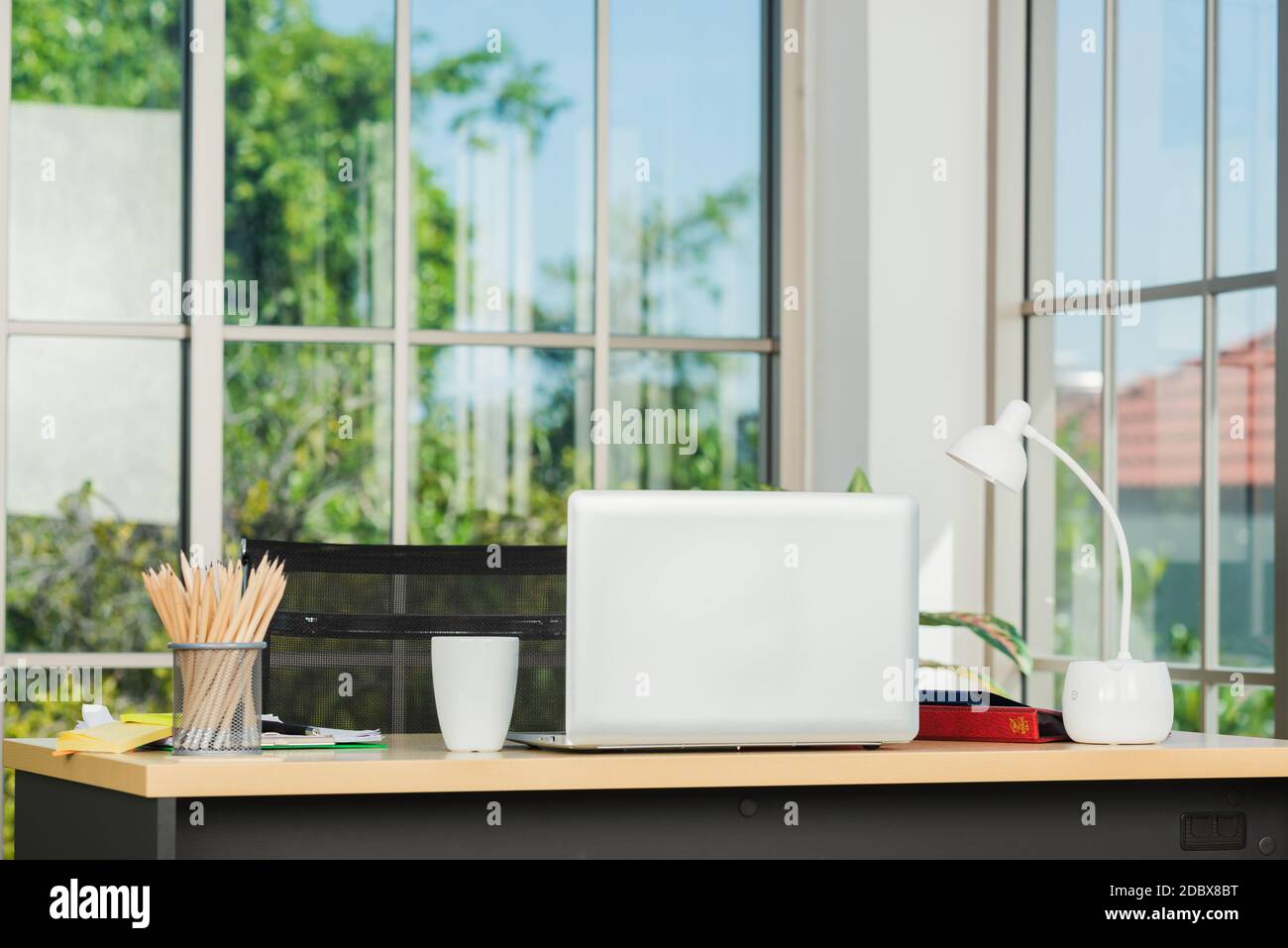 Back laptop computer putting on working desk, Workplace with notebook ...