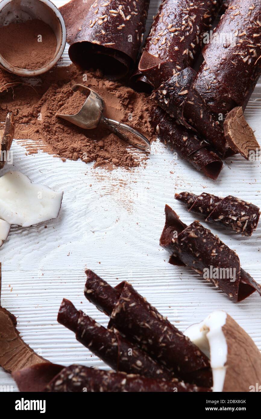 Chocolate pastille with coconut on a white background. Flat layout ...