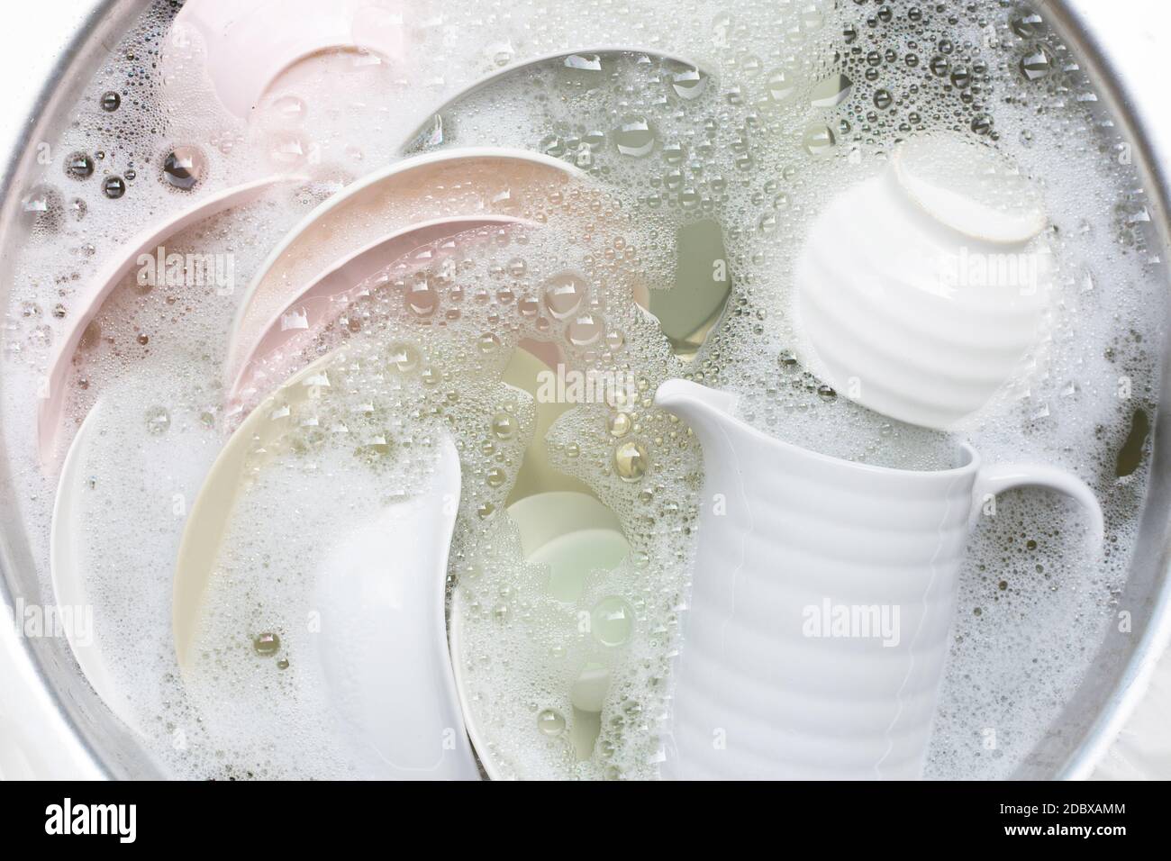 Washing dishes, Close up of utensils soaking in kitchen sink Stock ...