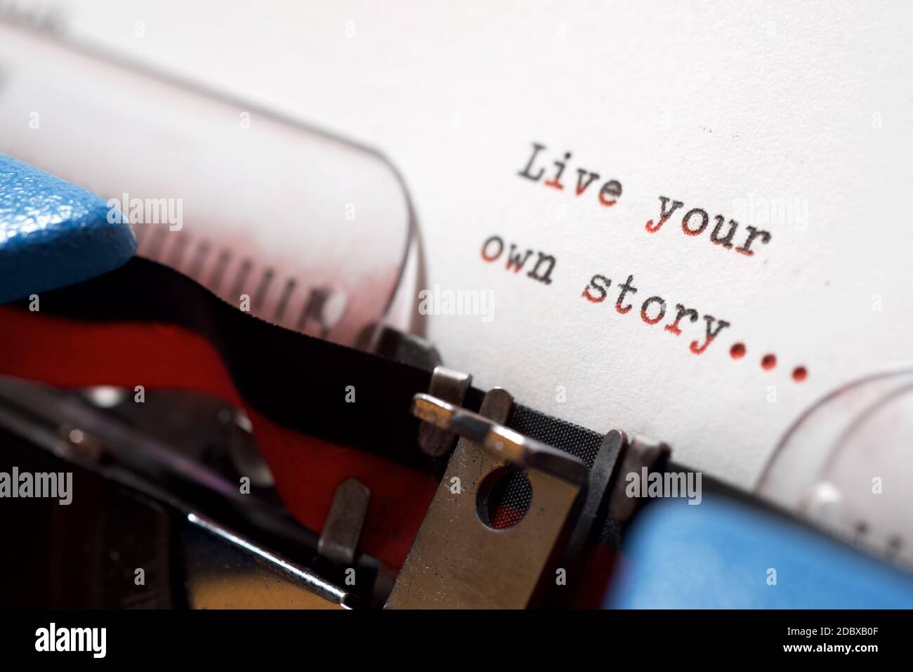 Live your own story phrase written with a typewriter Stock Photo - Alamy