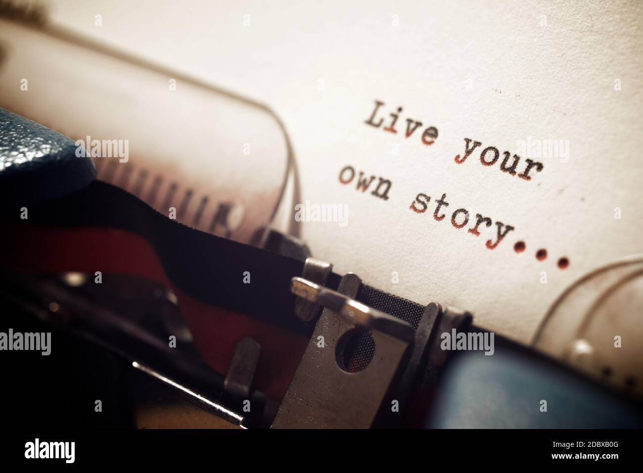 Live your own story phrase written with a typewriter Stock Photo - Alamy