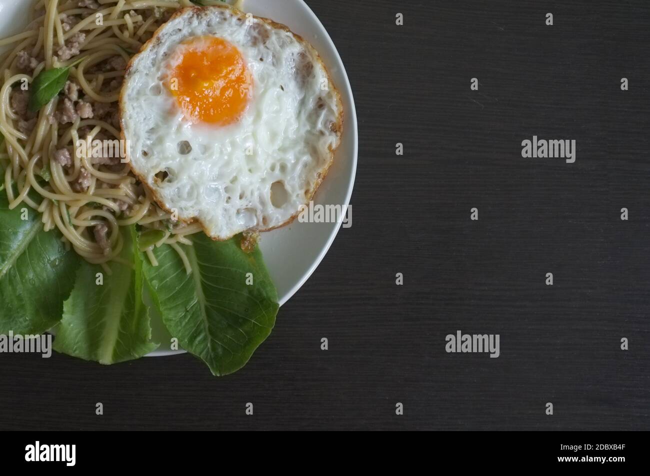 Spaghetti stir fried with Thai Basil spicy sauce with Fried egg ...
