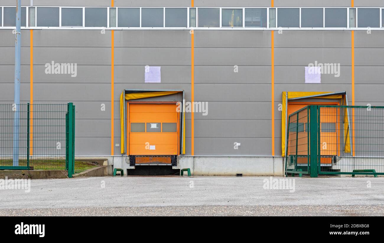 Loading Cargo Dock Doors at Distribution Warehouse Stock Photo - Alamy