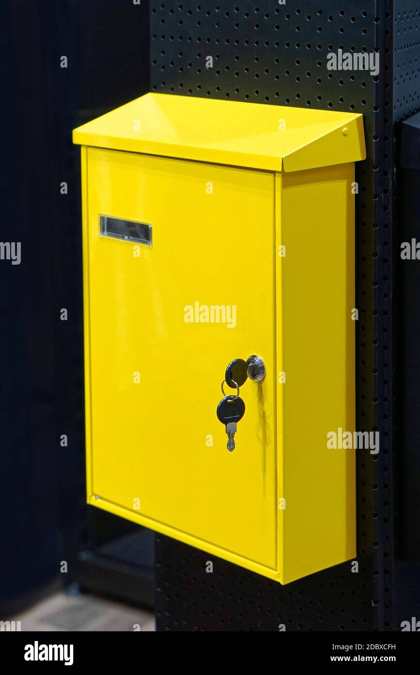 Bright yellow home mail box Stock Photo - Alamy