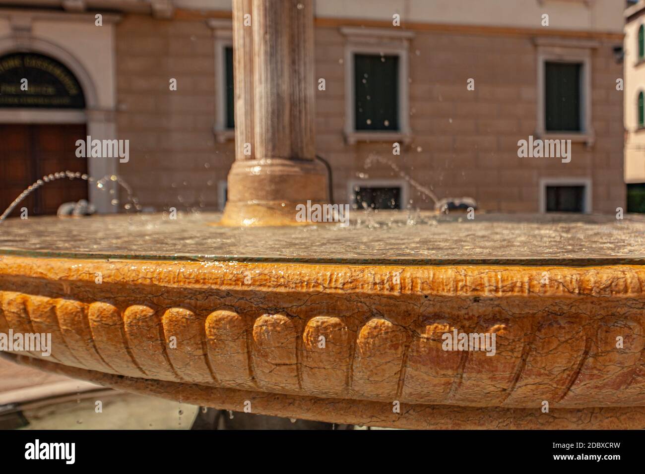 Ancient marble fountain with water in the historical city center of ...