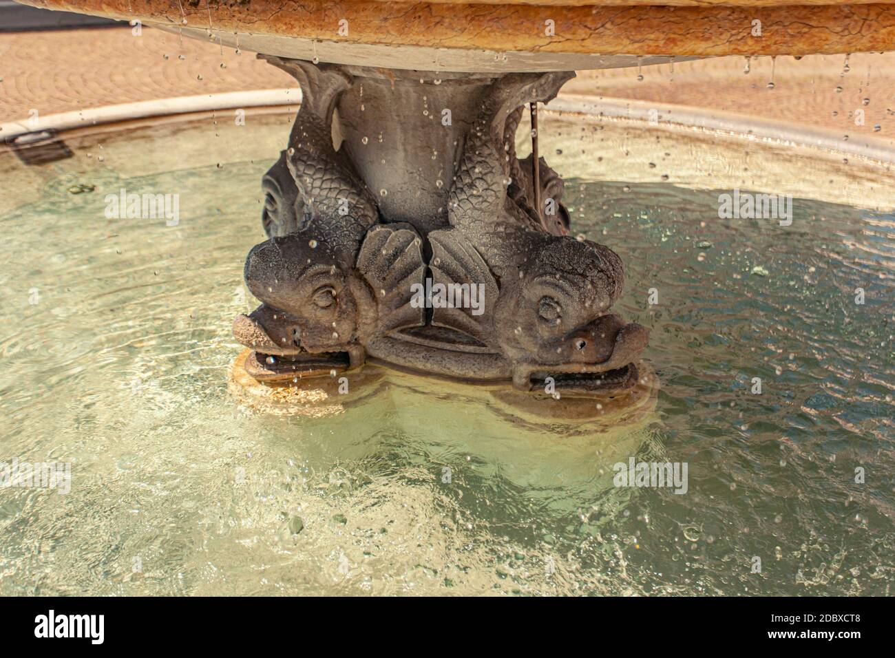 Ancient marble fountain with water in the historical city center of ...