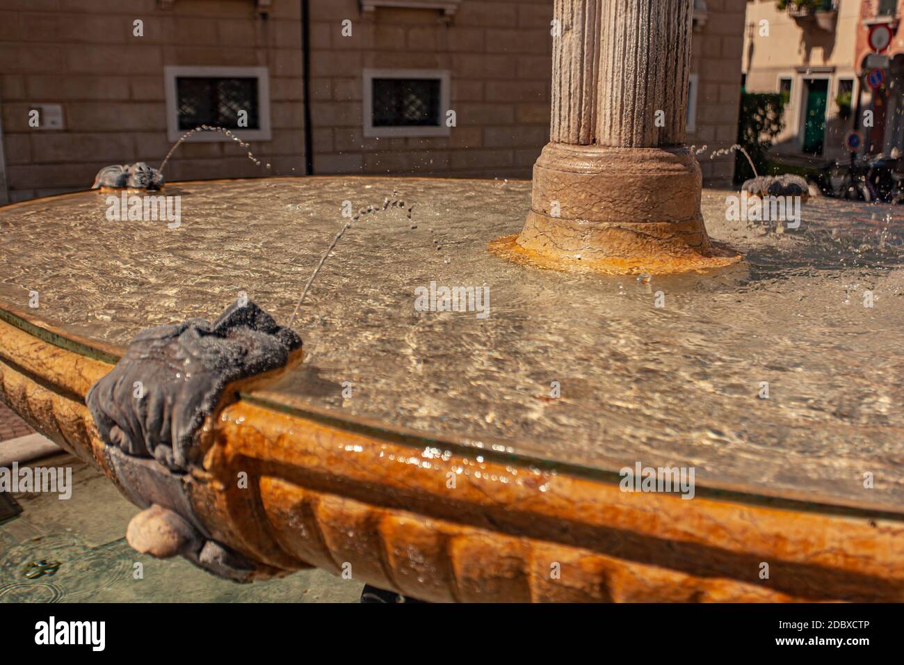 Ancient marble fountain with water in the historical city center of ...