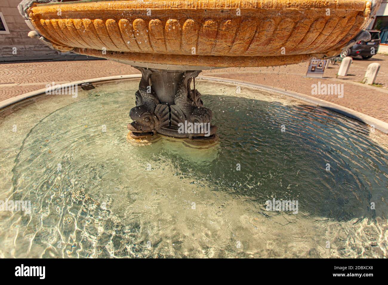 Ancient marble fountain with water in the historical city center of ...