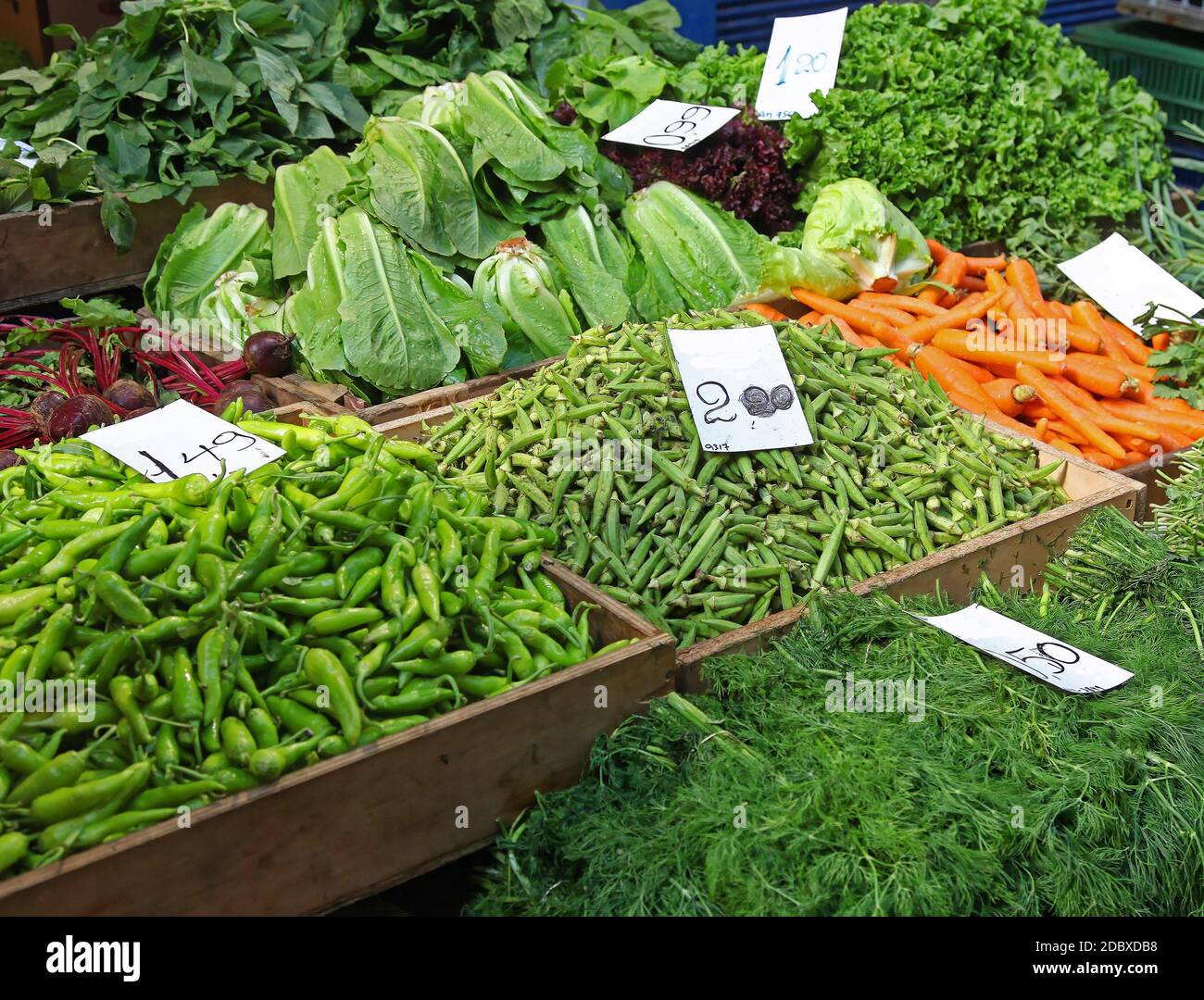 Fresh organic green vegetables sold on market stall Stock Photo - Alamy