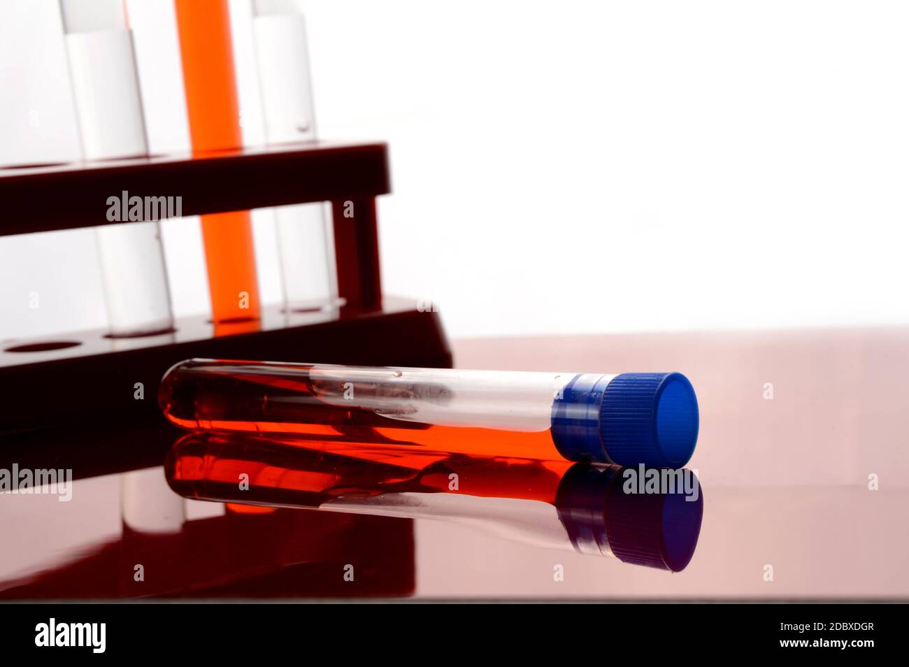 A sample is selected from the rack of test tubes Stock Photo - Alamy