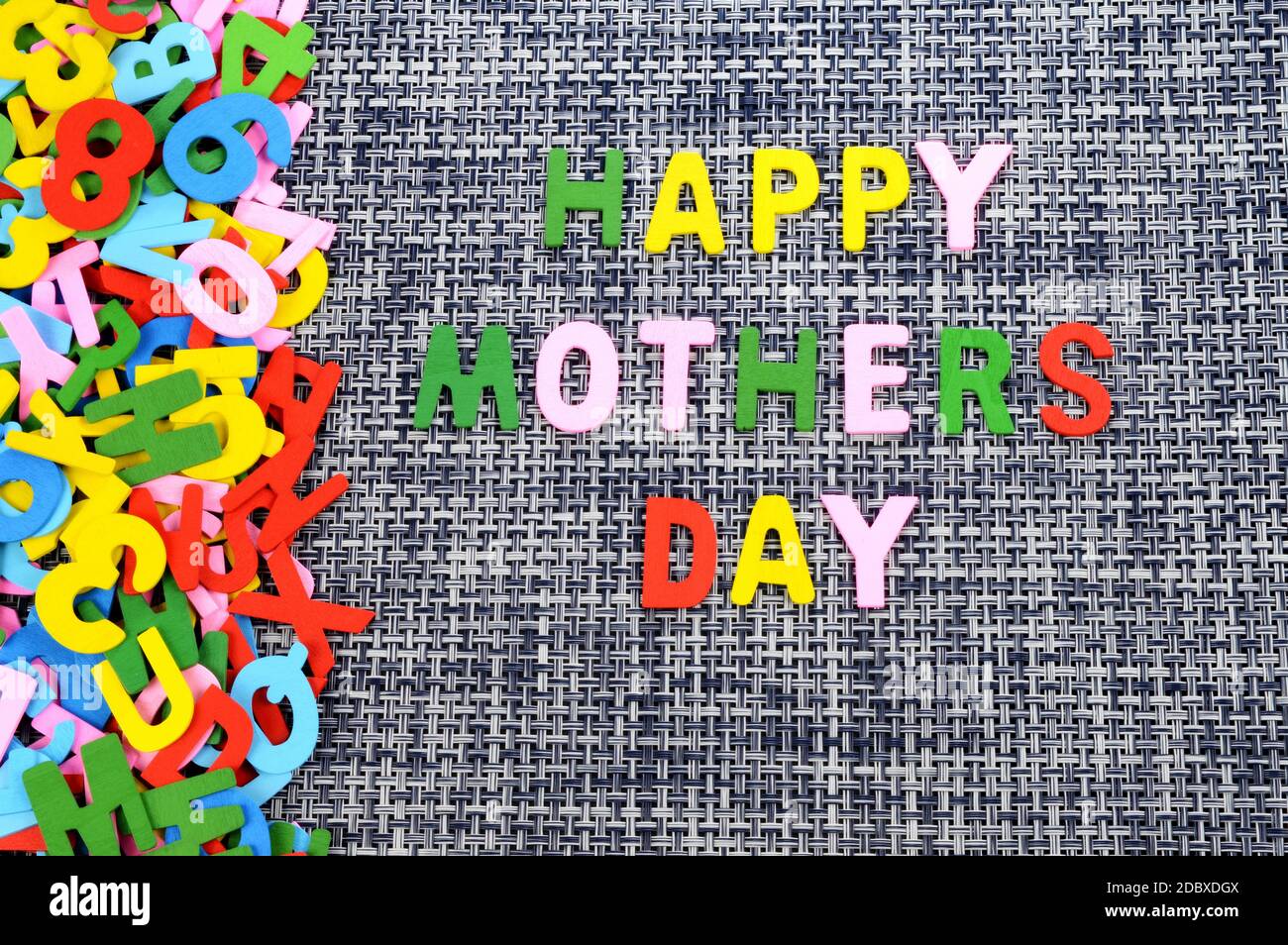 A childish creation of writing a Happy Mothers Day message using wooden ...