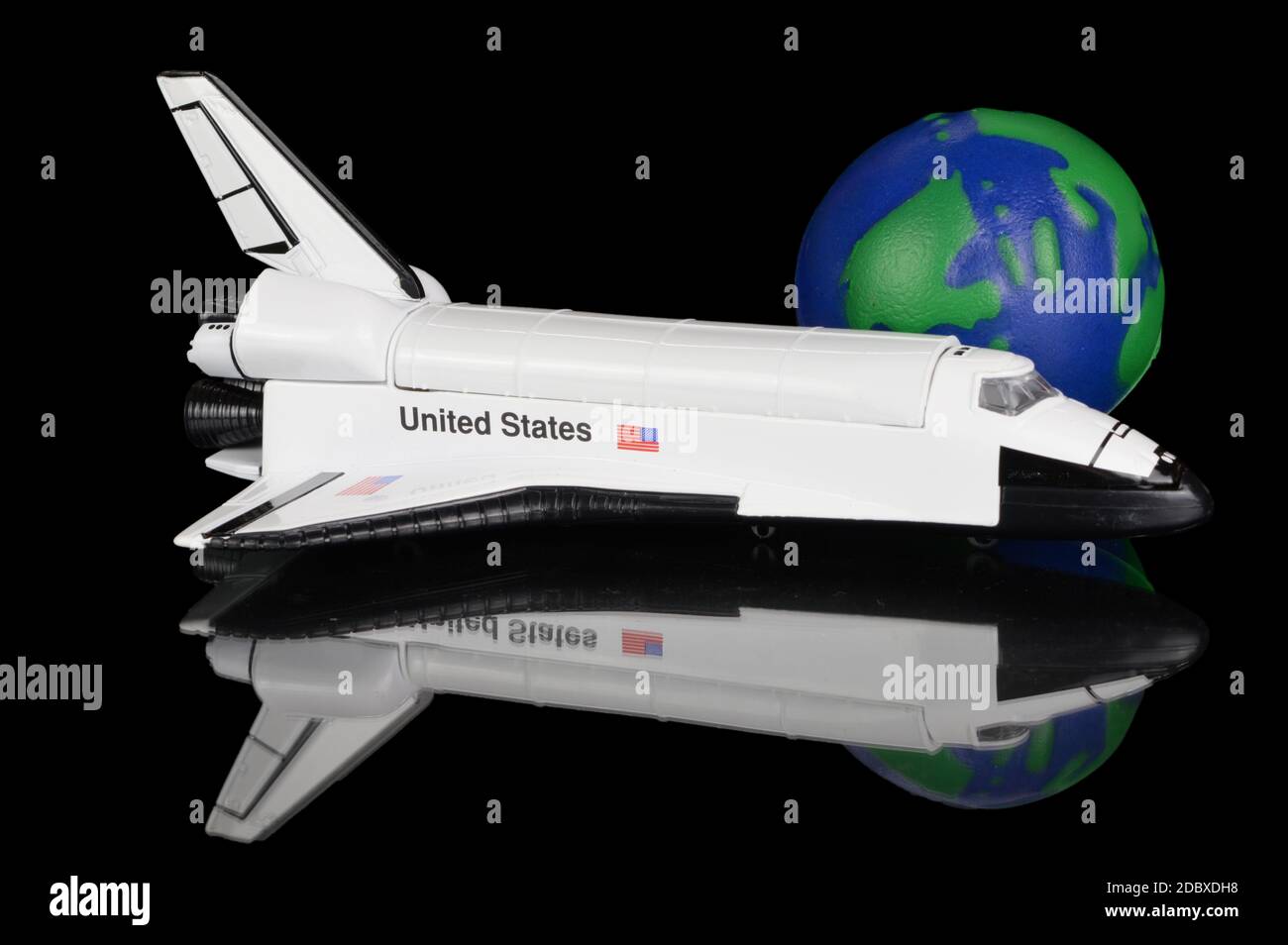 A still life composition of a spacecraft and an Earth globe for various ...