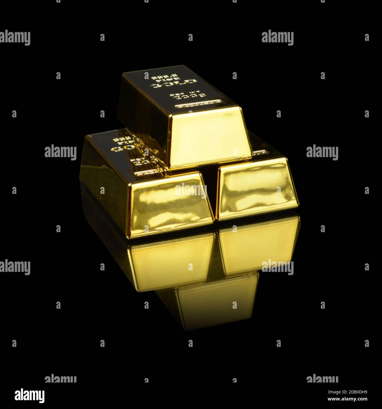 A stack of pure gold bullion bars over a black background Stock Photo ...