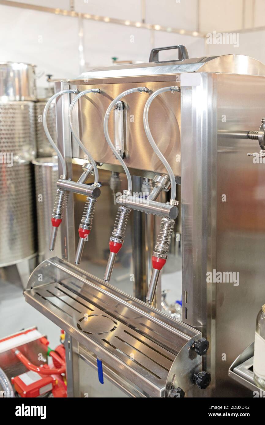 Bottle Filler Machine in Wine Production Line Stock Photo - Alamy