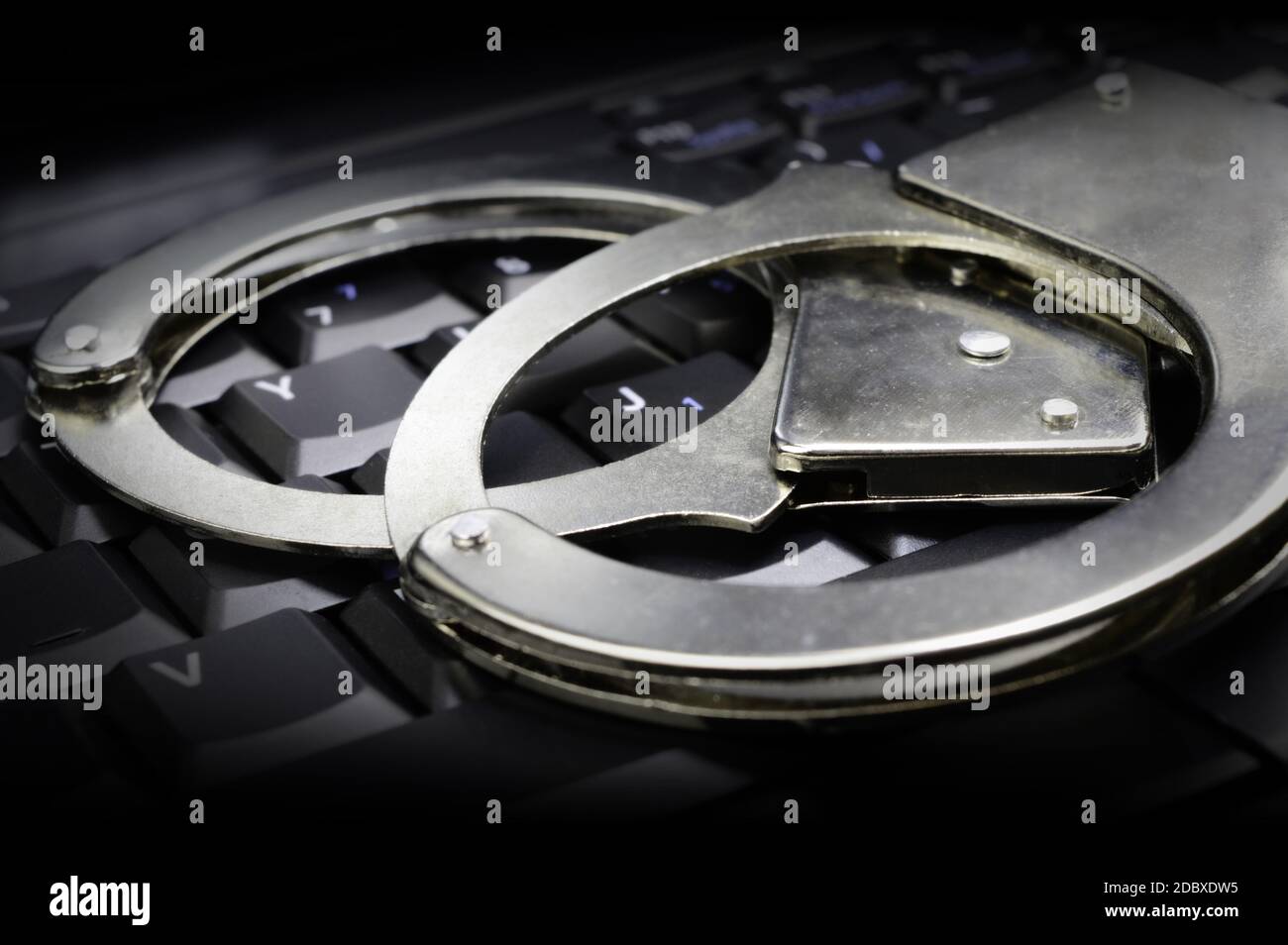 Handcuff on keyboard laptop hi-res stock photography and images - Alamy
