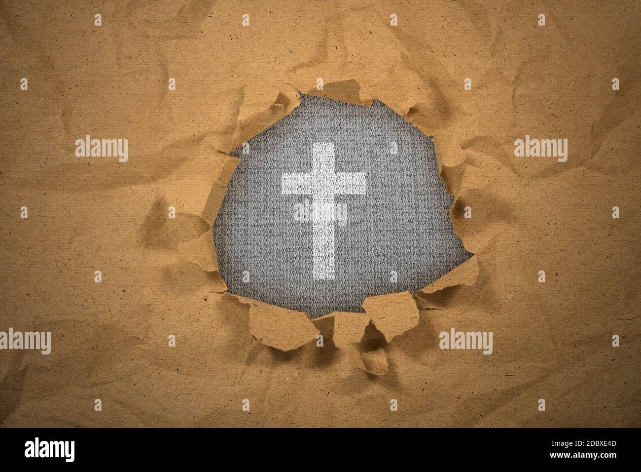 Ripped paper with Christian cross on black background Stock Photo - Alamy