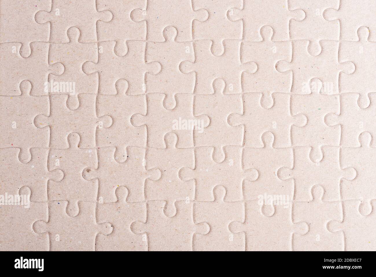 Top view flat lay of paper plain full white jigsaw puzzle game texture ...