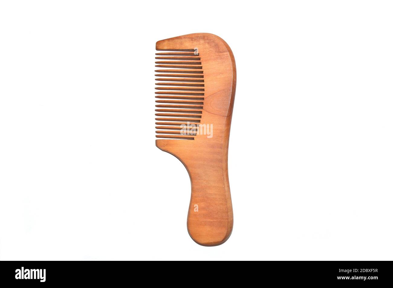 Wooden comb isolated on white Stock Photo - Alamy