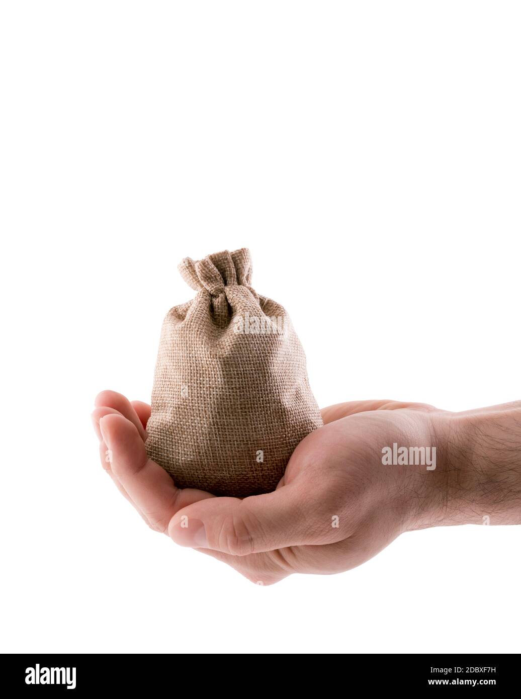 Hand with linen sack isolated on white background with clipping path ...