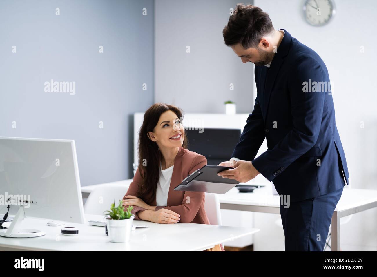 Business Process Review. 2 Employees In Office Stock Photo - Alamy