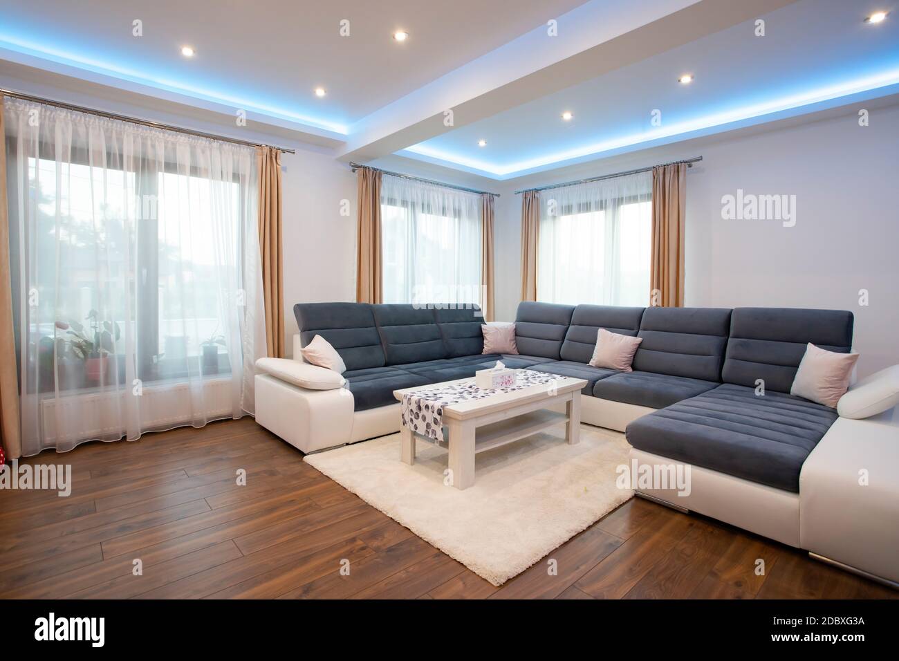 Modern living room interior - wide angle photo Stock Photo - Alamy