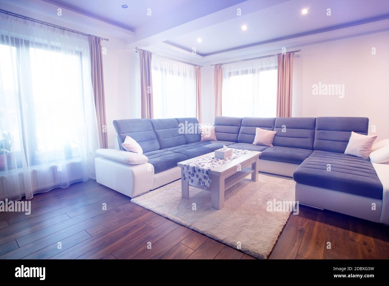 Modern living room interior - wide angle photo Stock Photo - Alamy