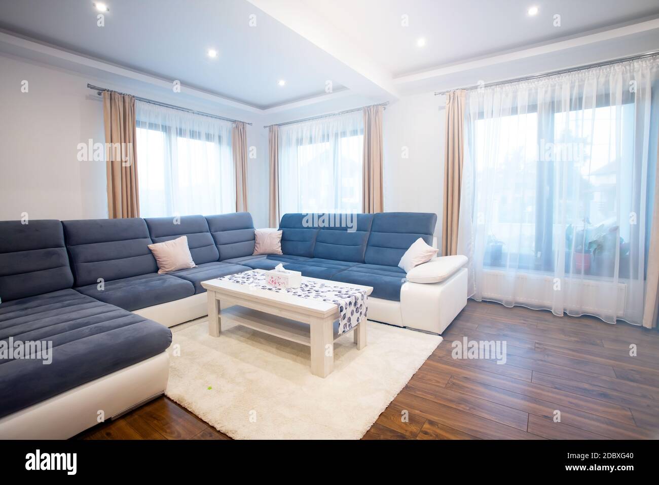 Modern living room interior - wide angle photo Stock Photo - Alamy