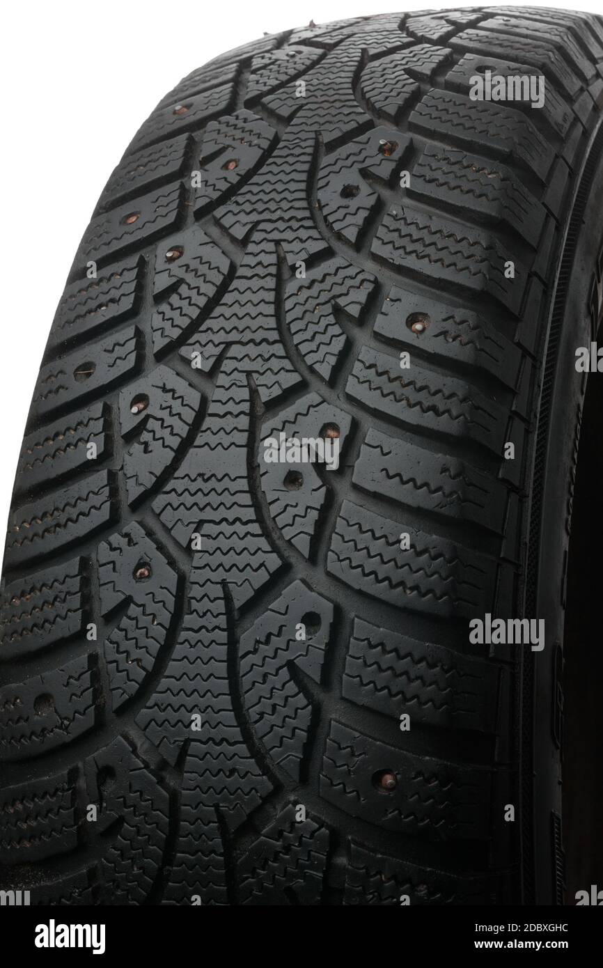 Old winter studded tire, isolated on white background Stock Photo - Alamy