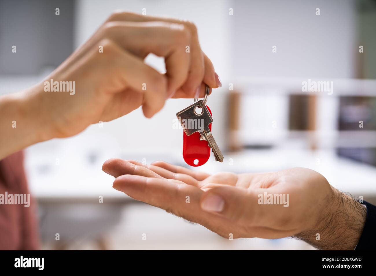 Man passing woman house keys hi-res stock photography and images - Alamy