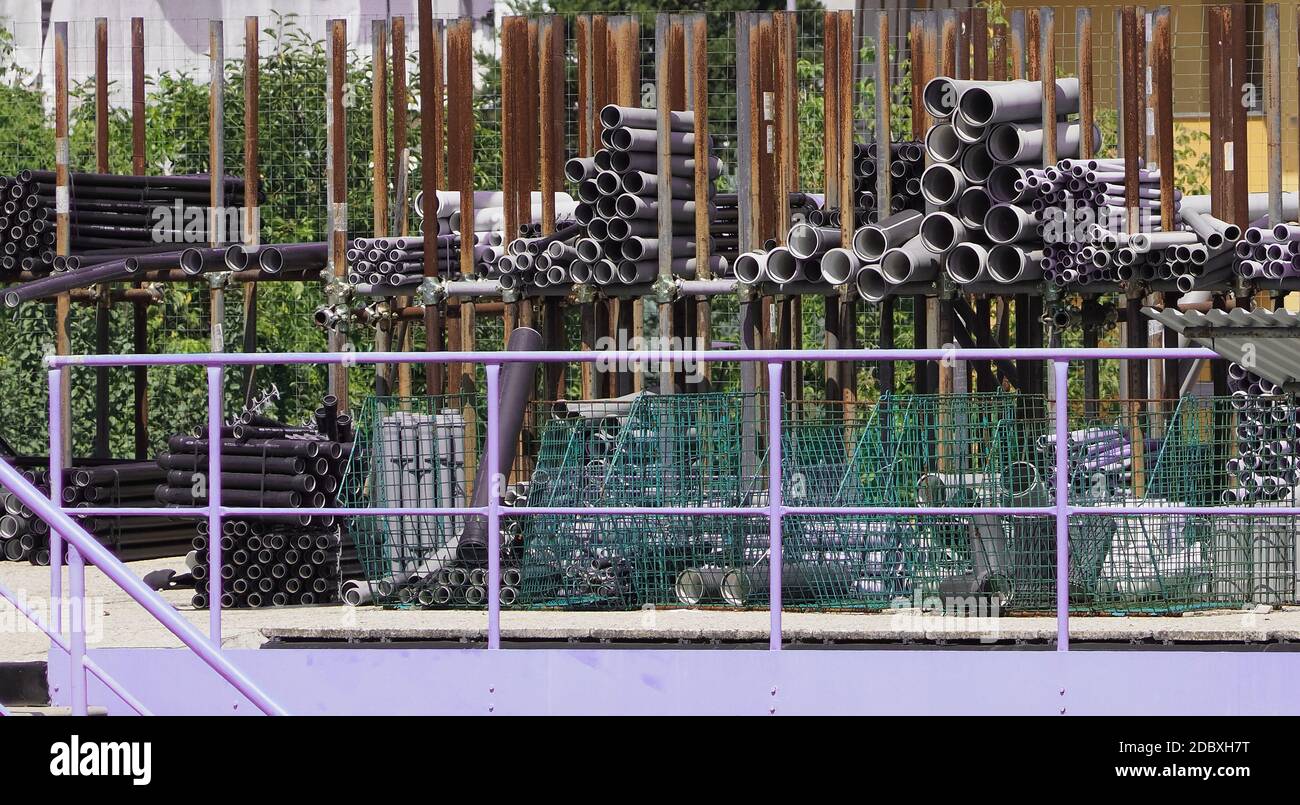 plastic and steel tubes and pipes storage Stock Photo - Alamy