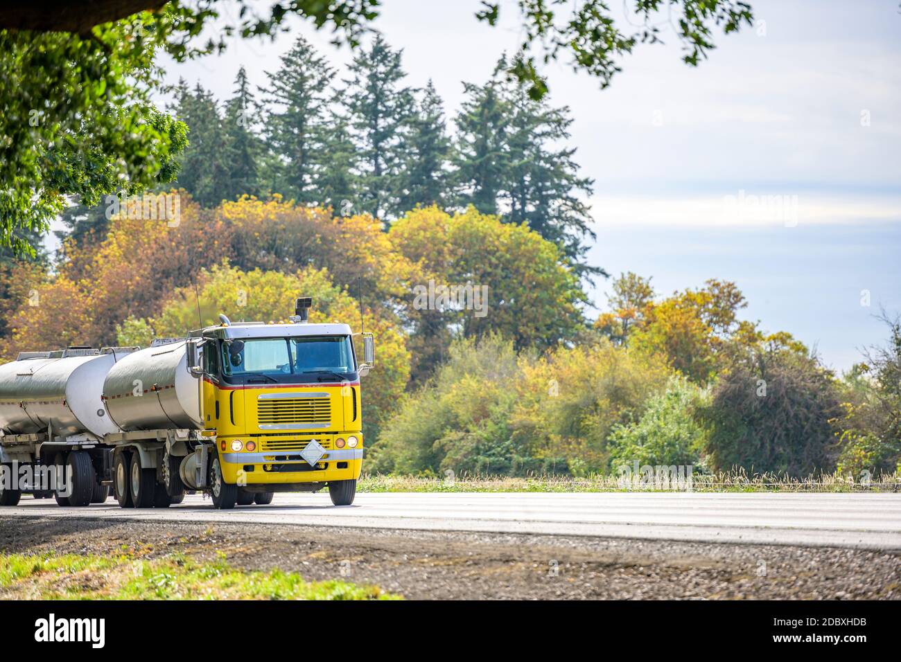 Compact powerful cab over engine big rig yellow semi truck tractor ...