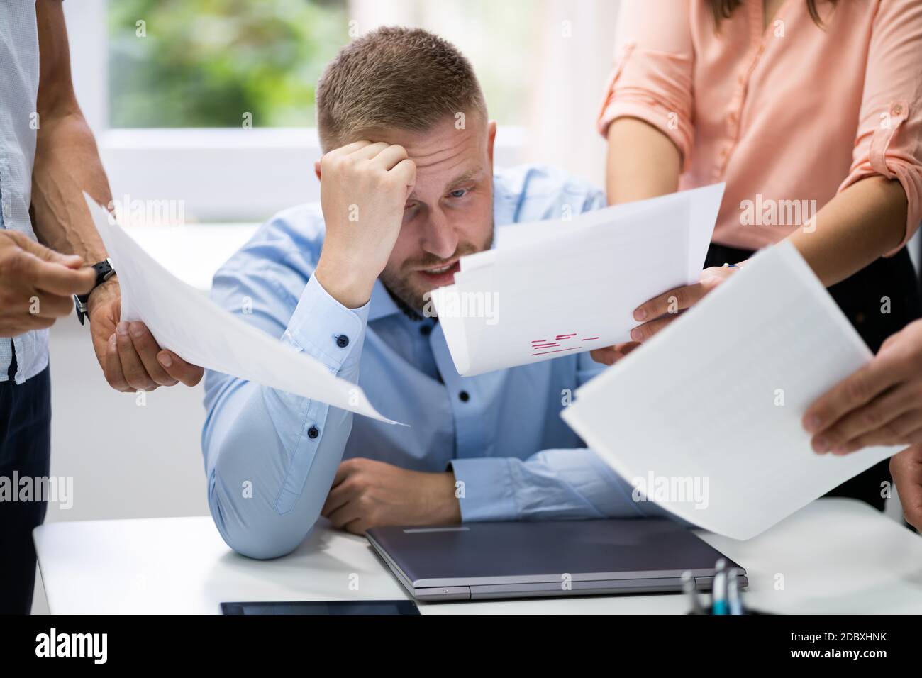 Stress At Workplace In Office. Business Headache Stock Photo - Alamy