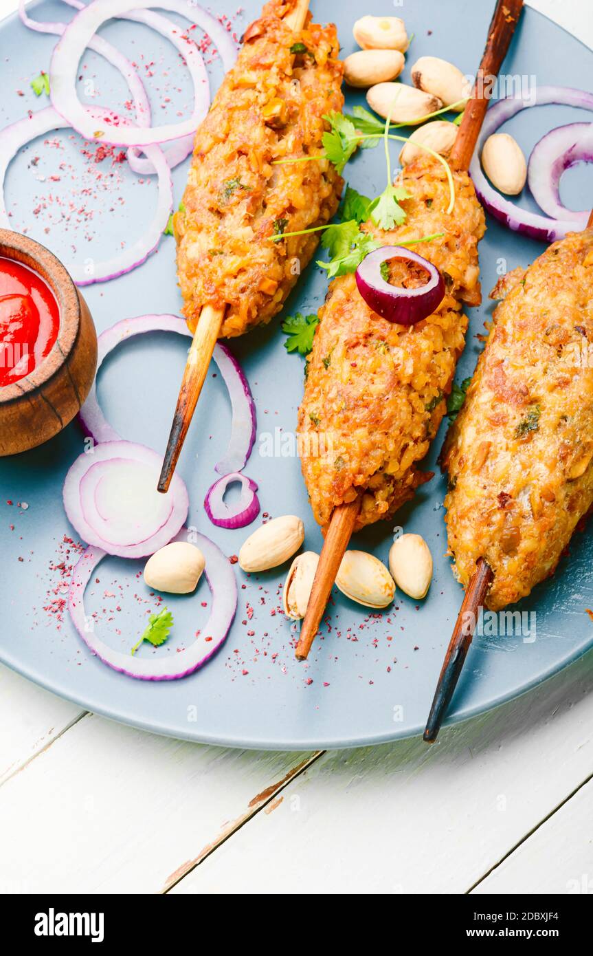 Lula kebab made from meat.Minced meat on the grill.Asian traditional ...