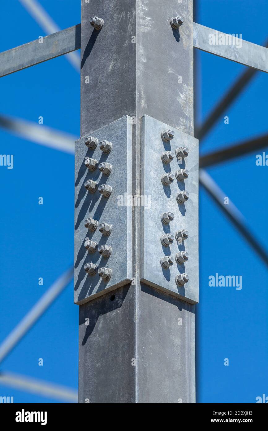 Detail view of electrical transmission lines metal mast connection ...