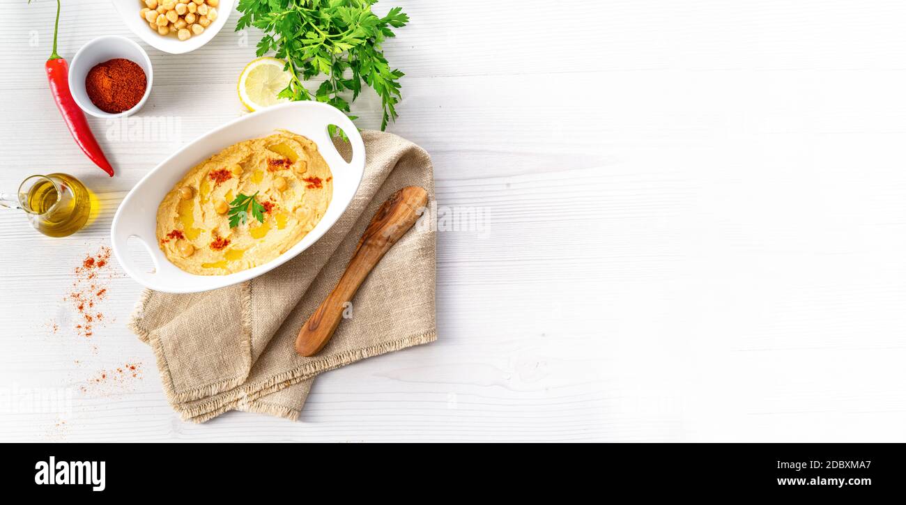 hummus paste with lemon and chilli on white background Stock Photo - Alamy